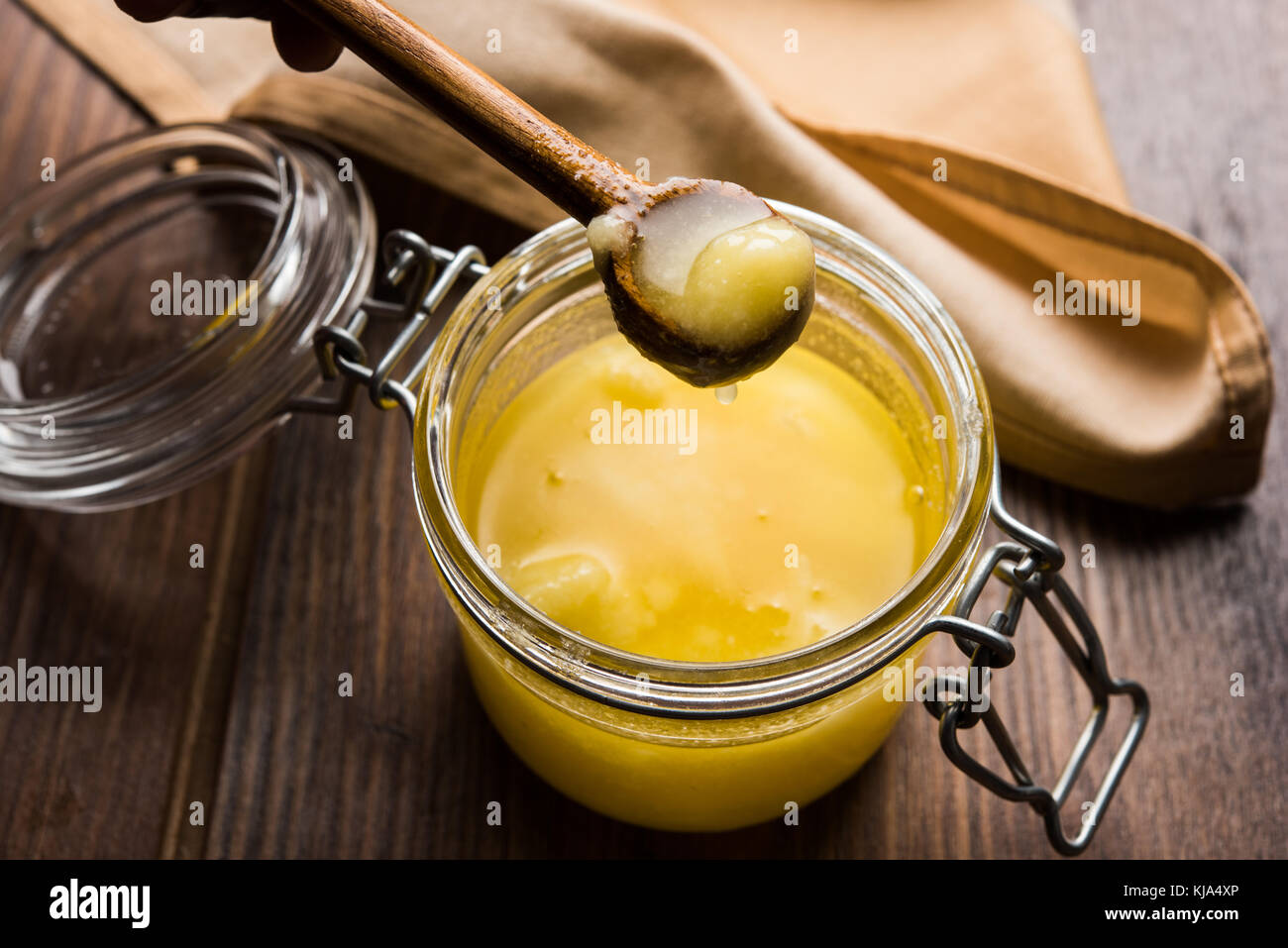 Desi Ghee or clarified butter in glass or Copper container or ceramic ...