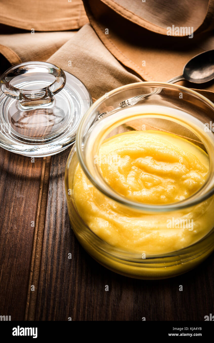 Desi Ghee or clarified butter in glass or Copper container or ceramic ...