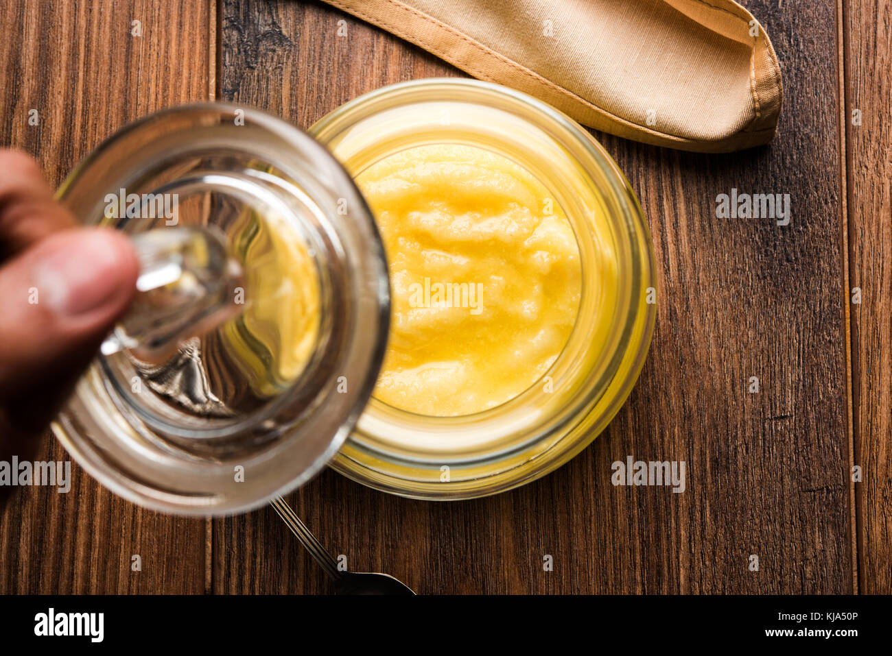 Desi Ghee or clarified butter in glass or Copper container or ceramic ...