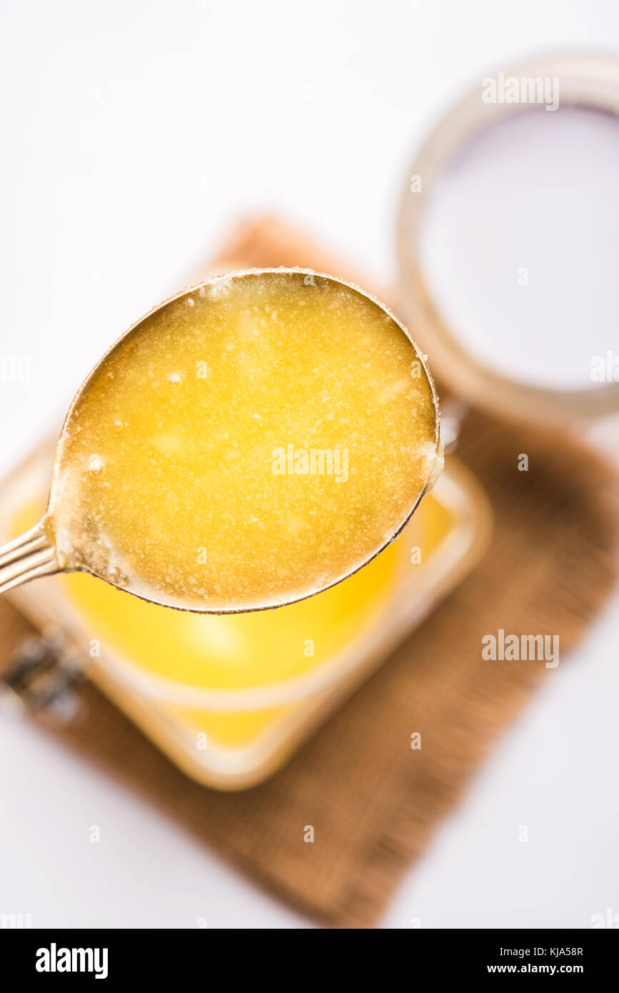 Desi Ghee or clarified butter in glass or Copper container or ceramic ...