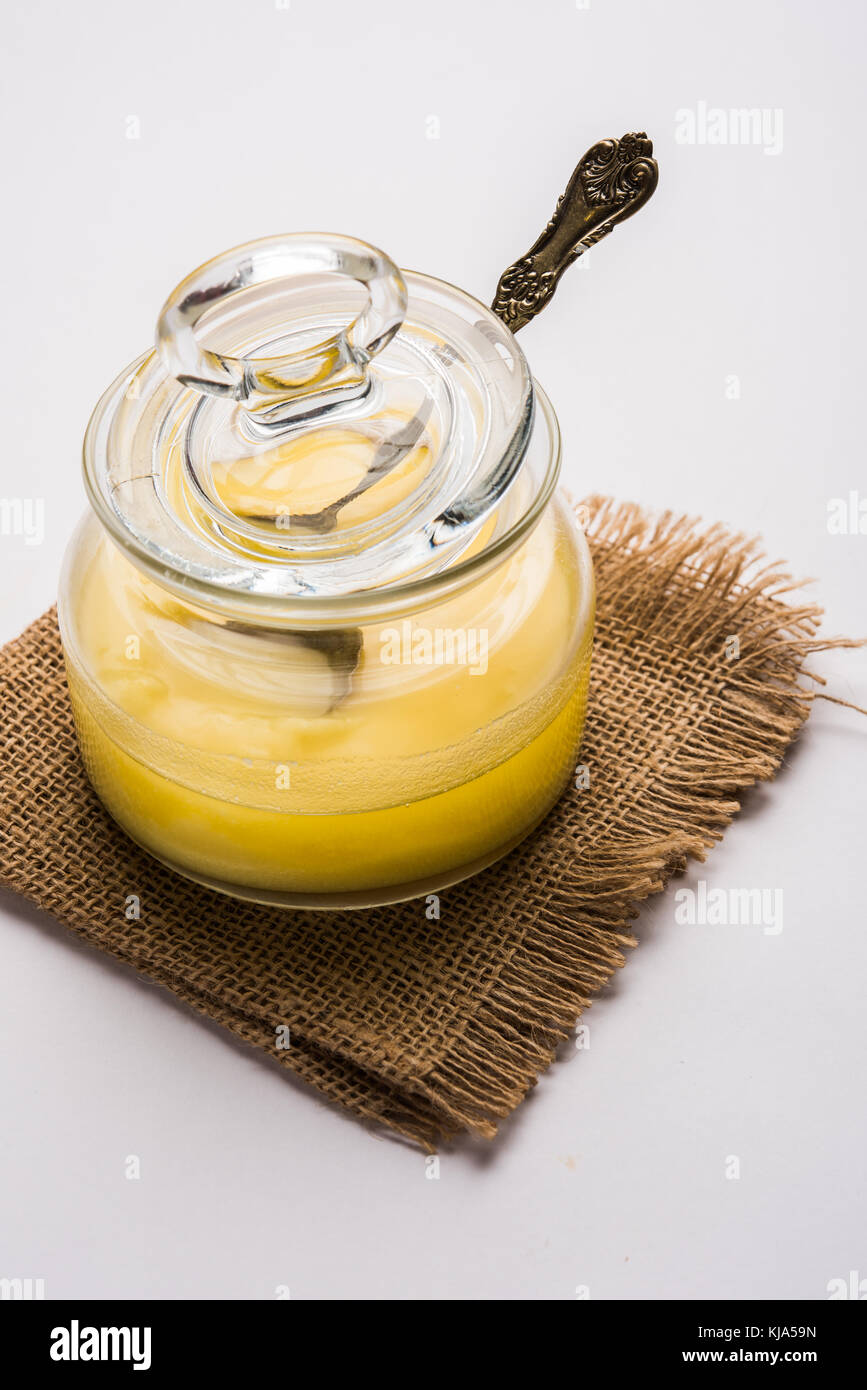Desi Ghee or clarified butter in glass or Copper container or ceramic ...