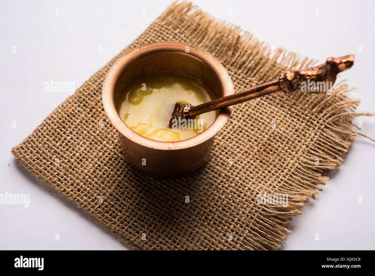 Desi Ghee or clarified butter in glass or Copper container or ceramic ...