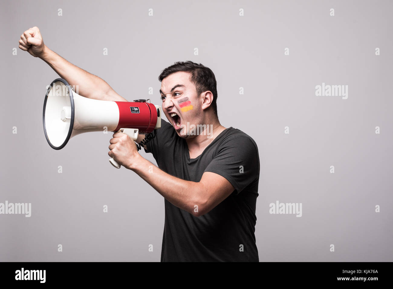 Scream on megaphone Germany football fan in game supporting of Germany ...