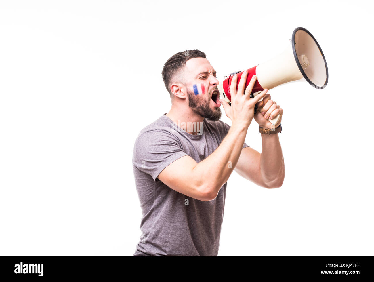 Scream on megaphone France football fan in game supporting of France ...