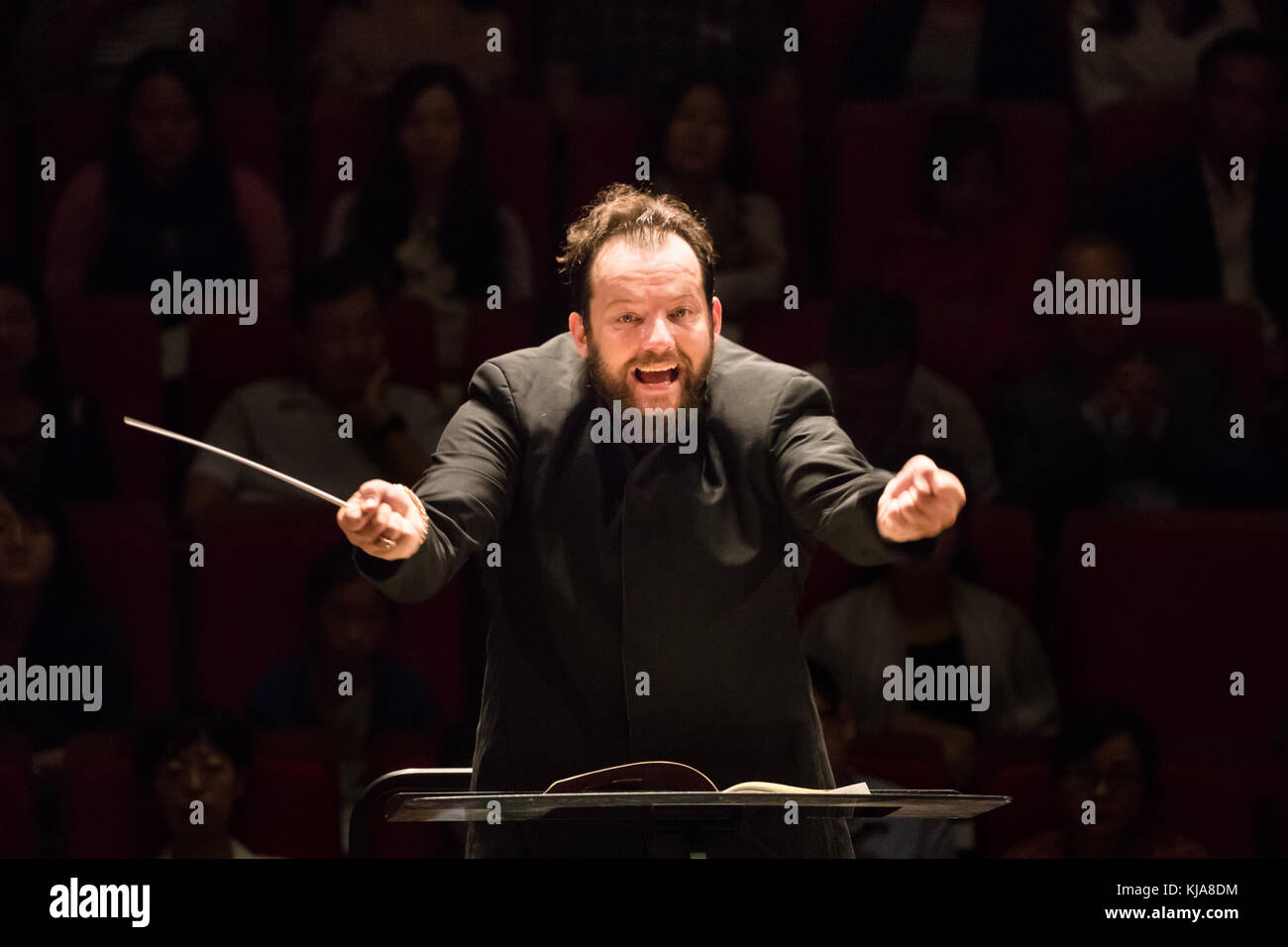 Latvian conductor Andris Nelsons performs at a concert in Shenzhen ...