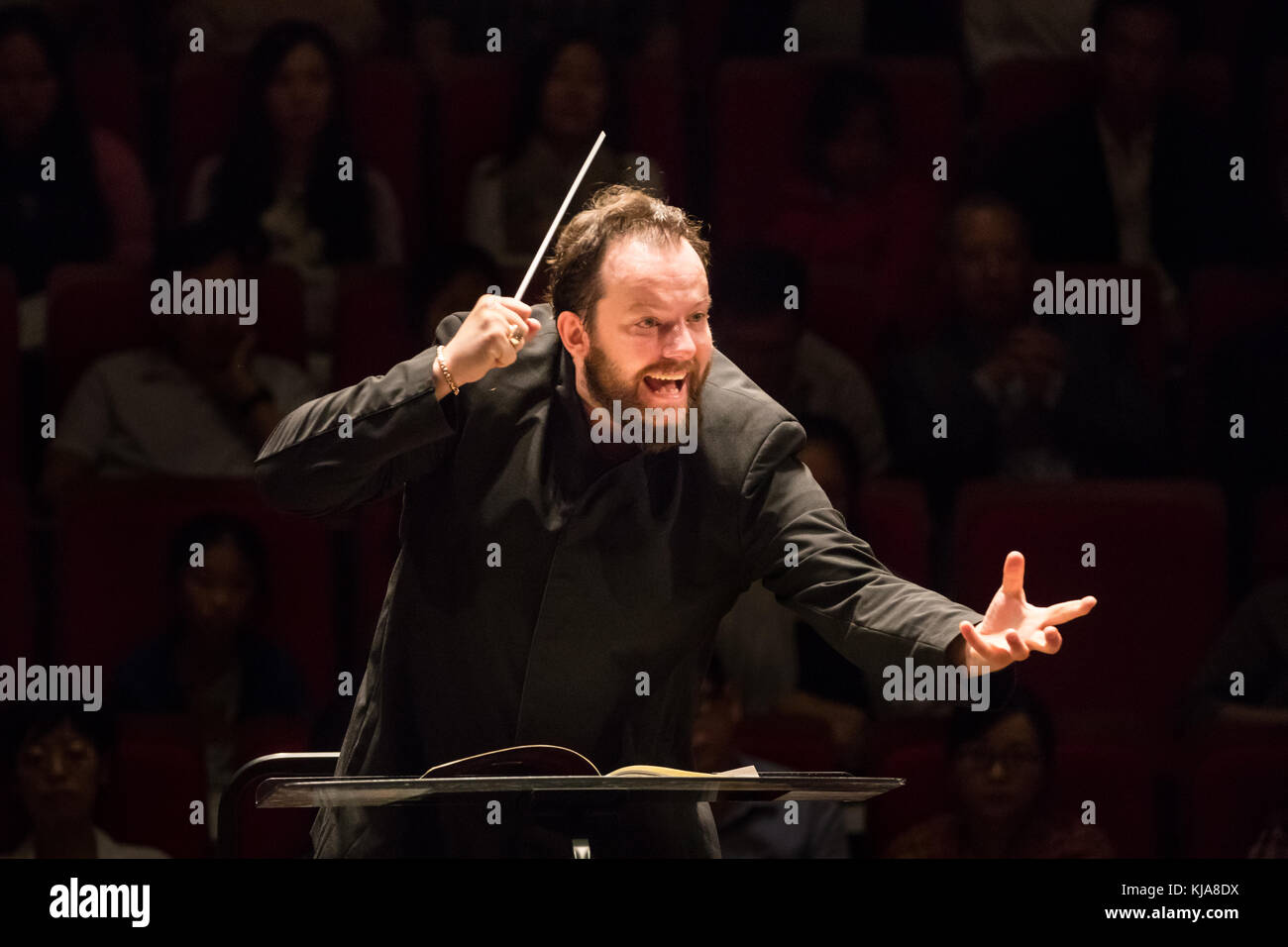 Latvian conductor Andris Nelsons performs at a concert in Shenzhen ...