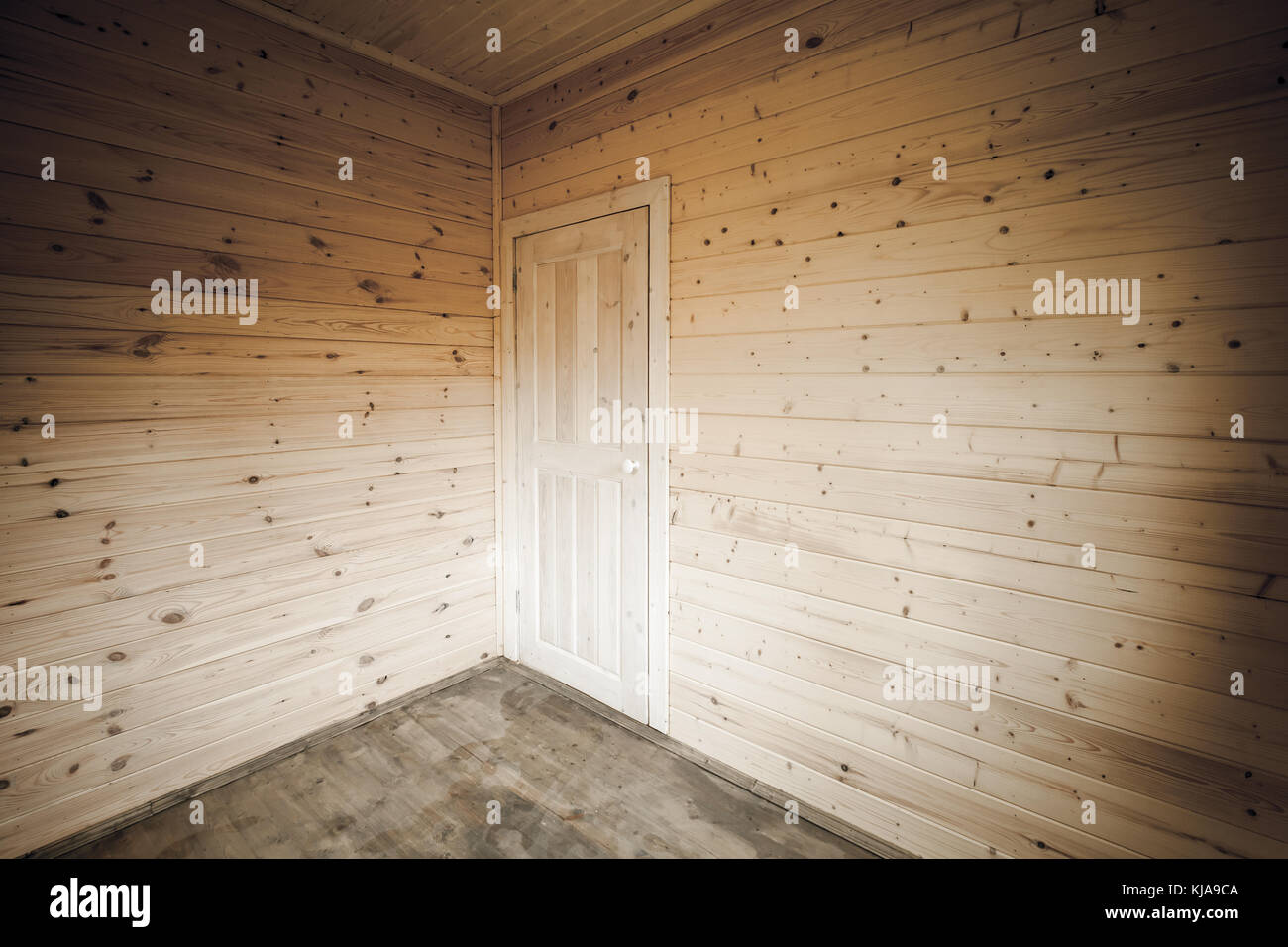 White door in the corner. Empty wooden house interior background Stock ...