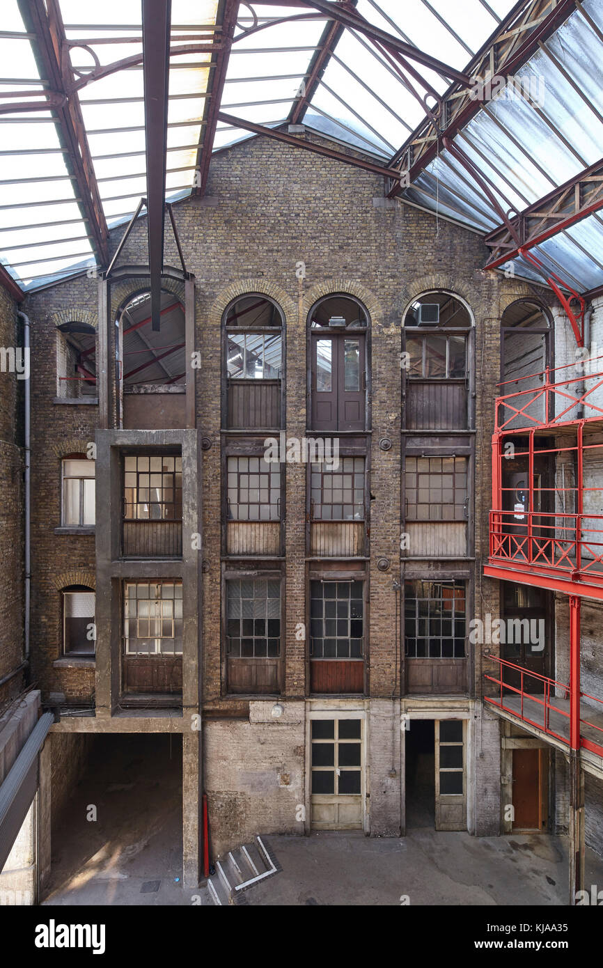 Full-height atrium with skylight and original features. The Farmiloe ...