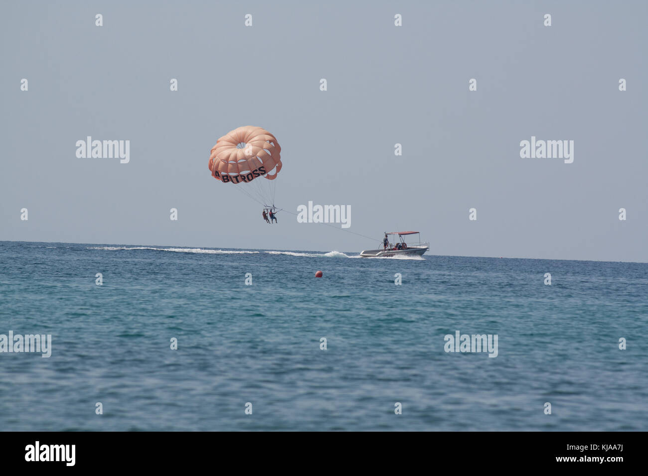 Parasailing on speedboat Stock Photo - Alamy
