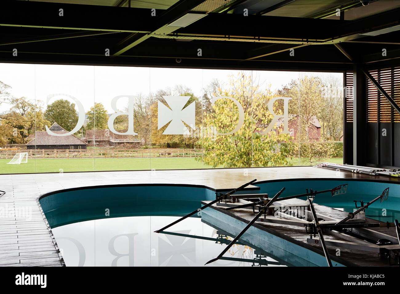 Interior view with rowing oars in the pool. Radley Rowing Centre ...
