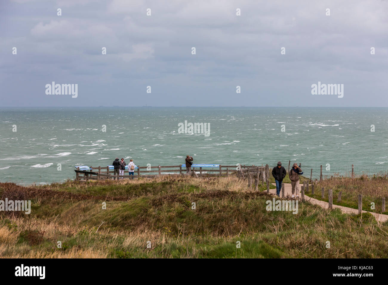 Visitors retreat from the windiest part of the Cap Gris Nez overlooking ...