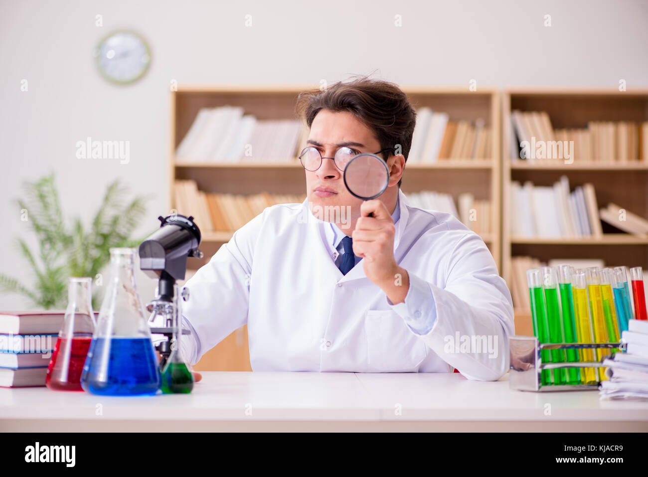 Mad crazy scientist doctor doing experiments in a laboratory Stock ...