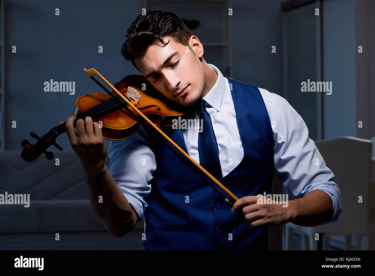 Young musician man practicing playing violin at home Stock Photo - Alamy