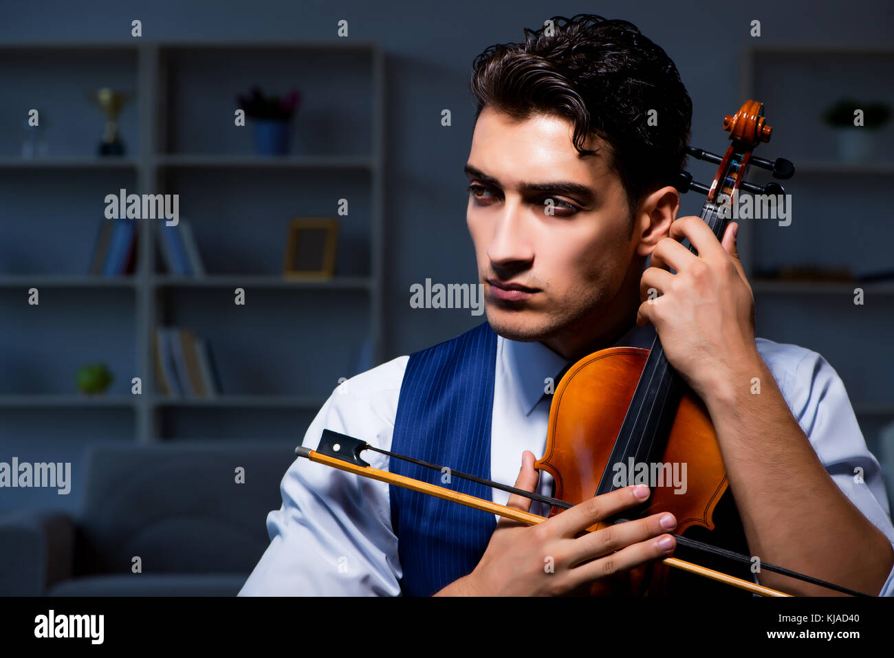 Young musician man practicing playing violin at home Stock Photo - Alamy