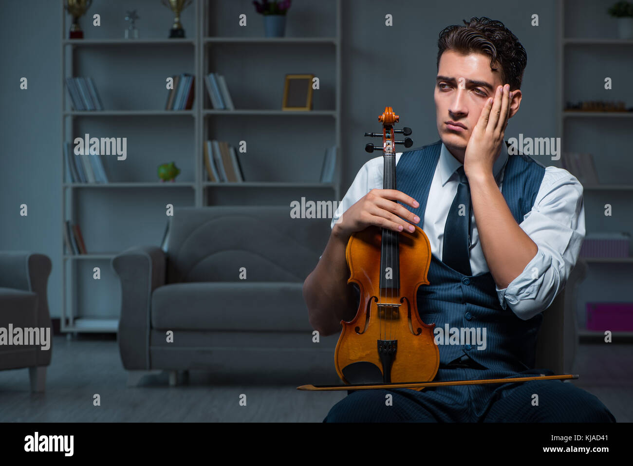Young musician man practicing playing violin at home Stock Photo - Alamy