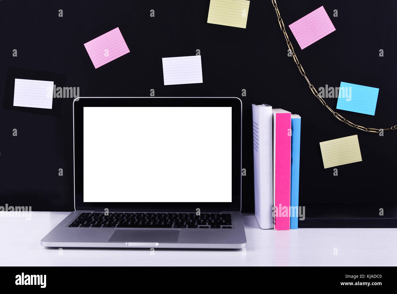 Stylish workspace with laptop computer, office supplies, camera, sticky ...