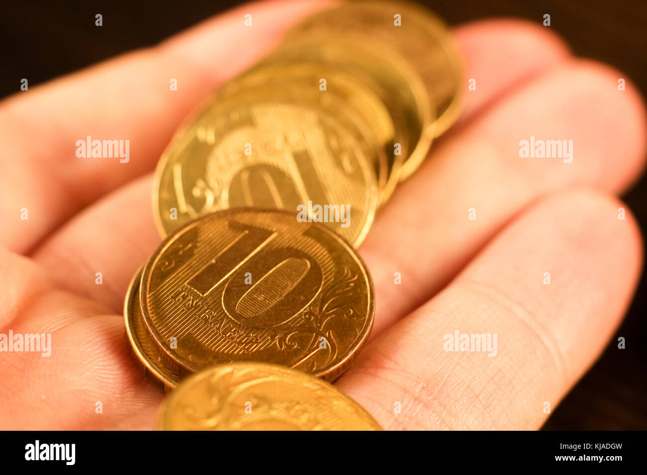 Hand holding a set of russian ruble coins. Russian currency. Financial ...