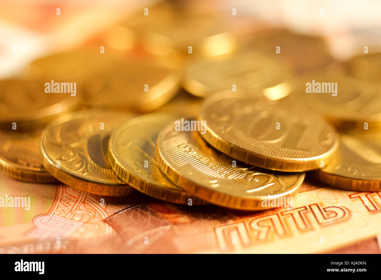 Set of russian ruble coins laying on russian banknotes. Russian ...
