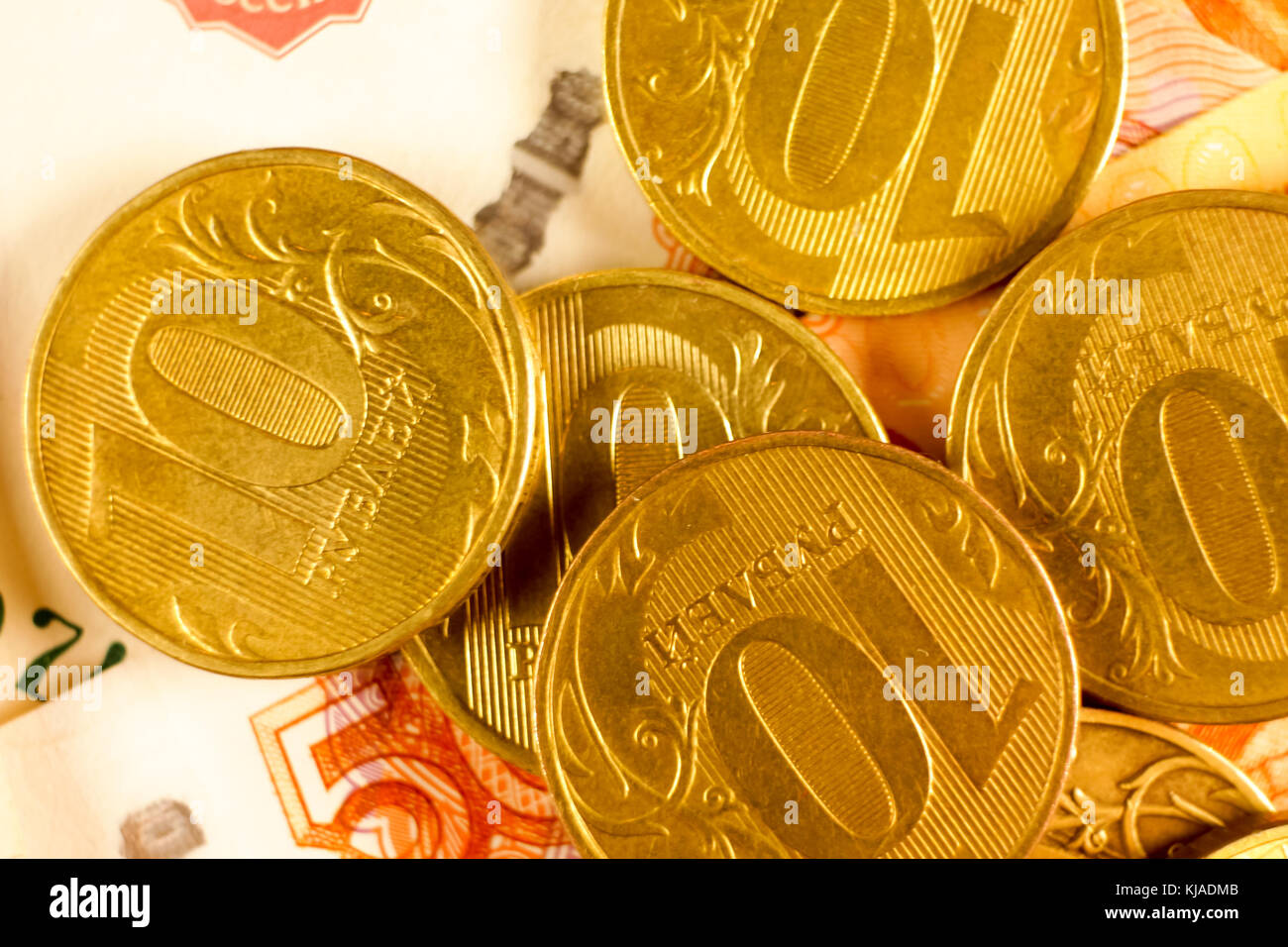 Set of russian ruble coins laying on russian banknotes. Russian ...