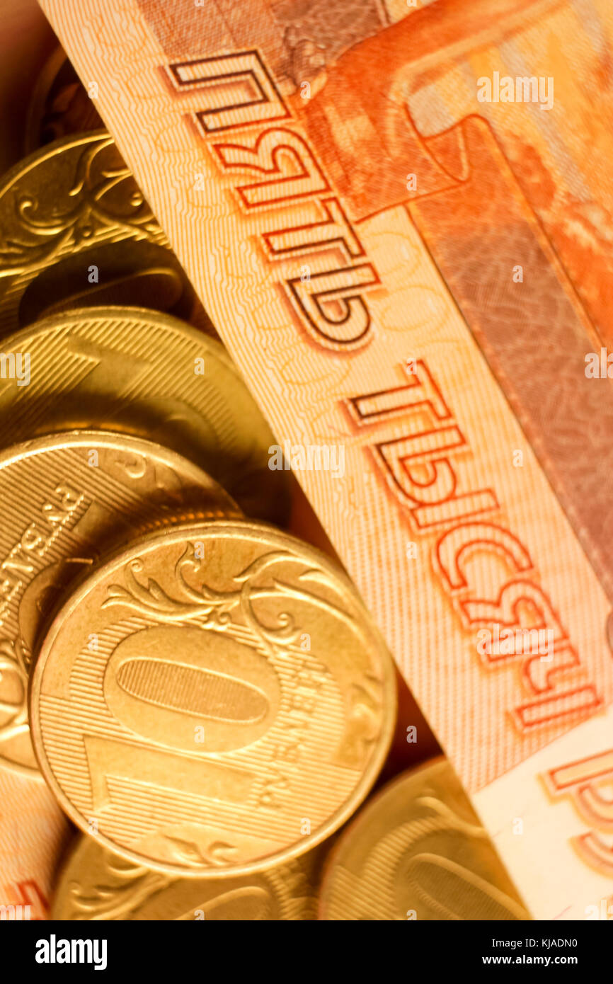 Set of russian ruble coins laying on russian banknotes. Russian ...