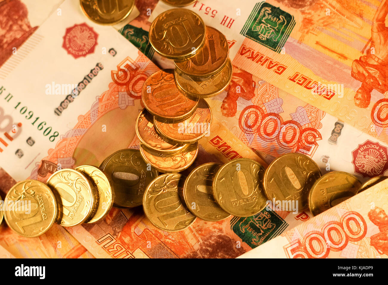 Set of russian ruble coins laying on russian banknotes. Russian ...