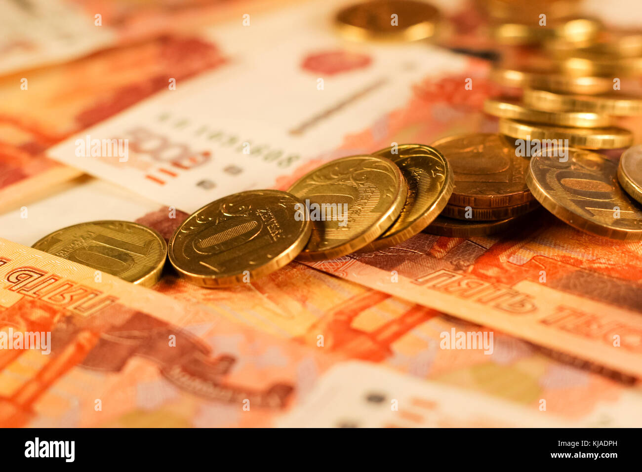 Set of russian ruble coins laying on russian banknotes. Russian ...