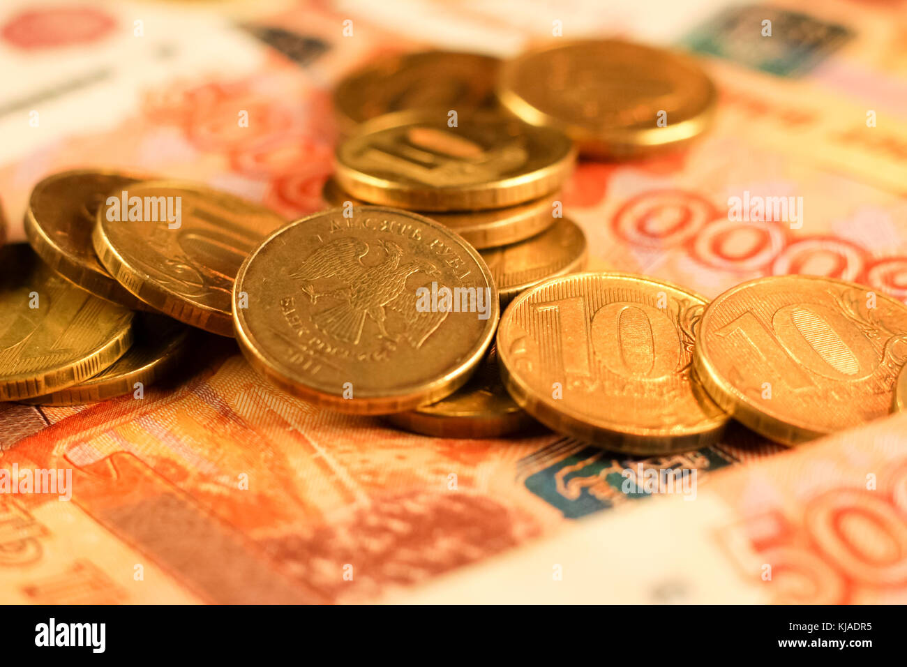 Set of russian ruble coins laying on russian banknotes. Russian ...