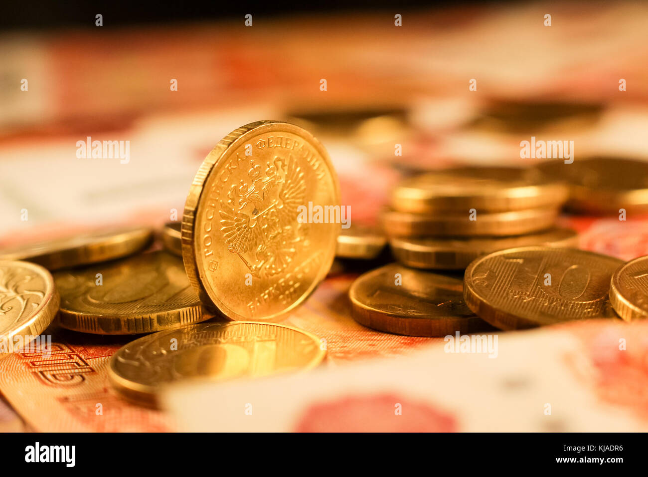 Set of russian ruble coins laying on russian banknotes. Russian ...