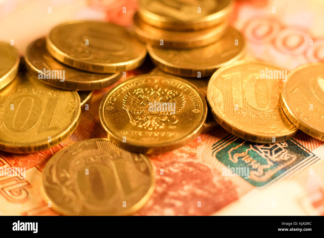 Set of russian ruble coins laying on russian banknotes. Russian ...