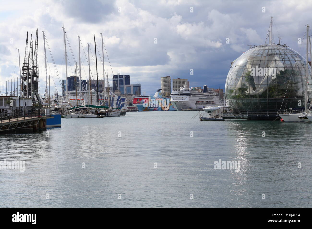 The port of Genova Italy: water, piers, ships, and a glass house Stock ...