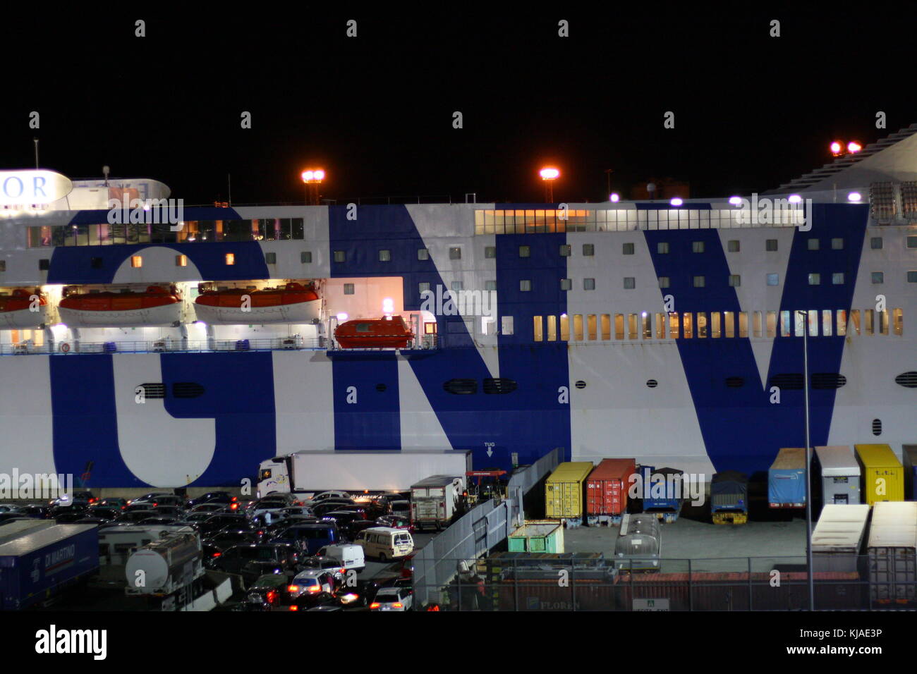 A giant GNV lines ferry in the port of Genova, Italy, at night, ready ...