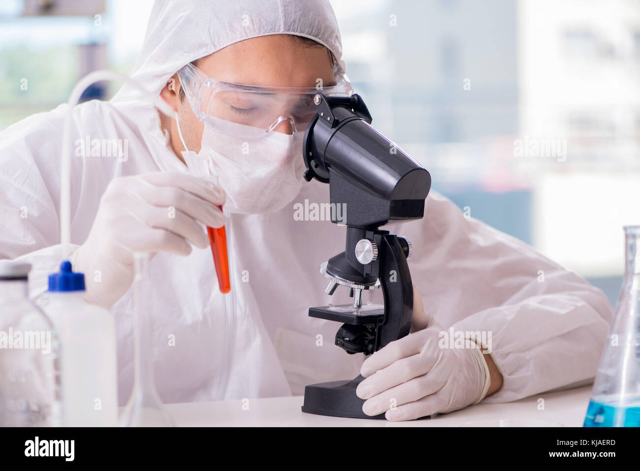 Chemist working in the laboratory with hazardous chemicals Stock Photo ...