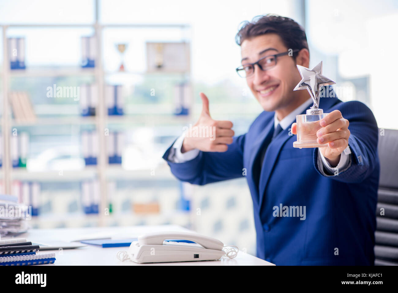 Businessman winning best employee of the month award Stock Photo - Alamy