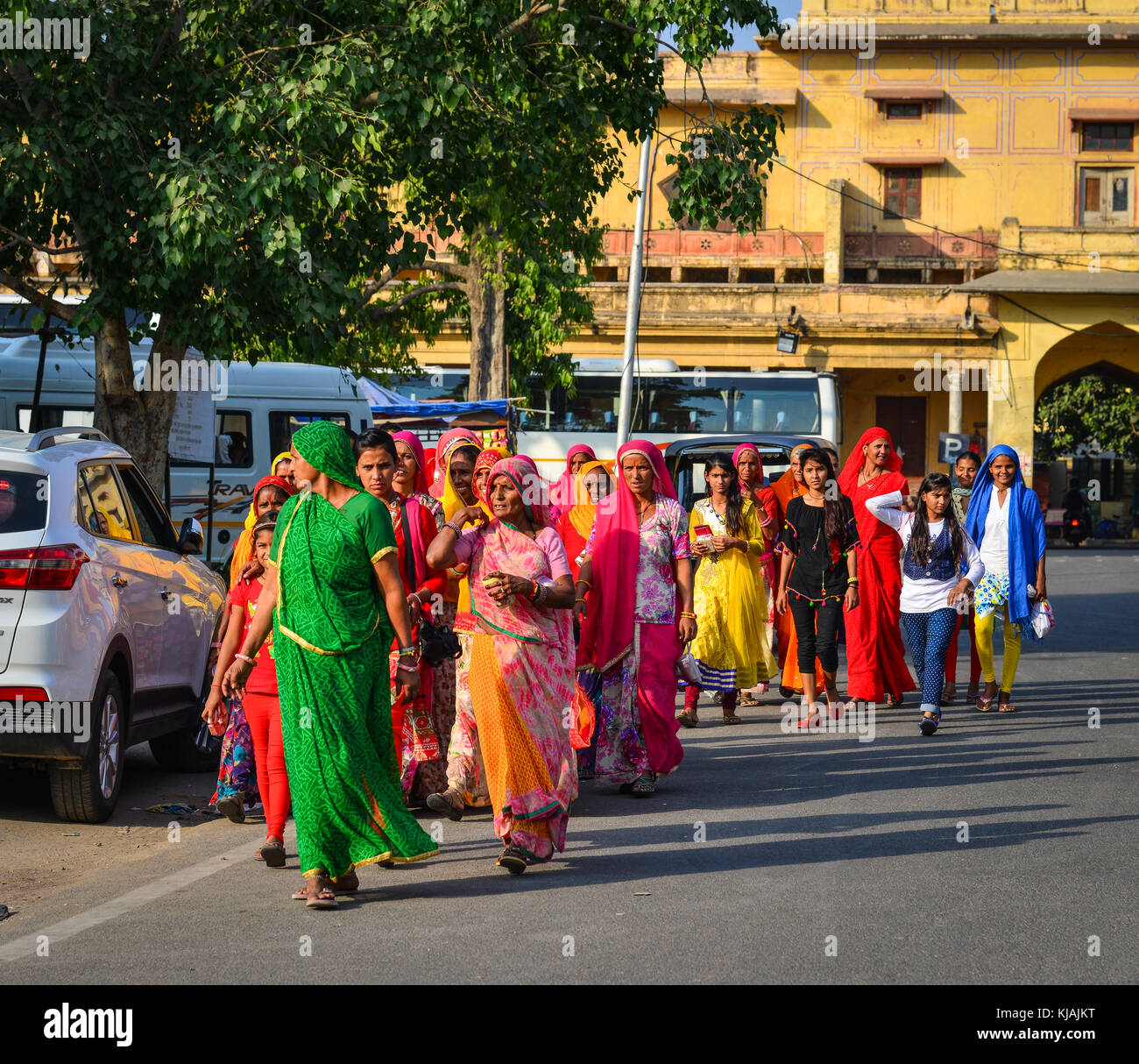 Jaipur, India - Nov 1, 2017. Women in colorful sari walking on street ...