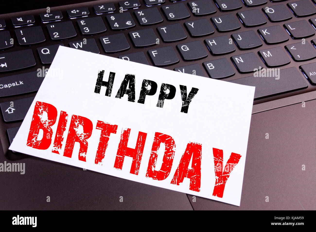 Writing Happy Birthday text made in the office close-up on laptop ...