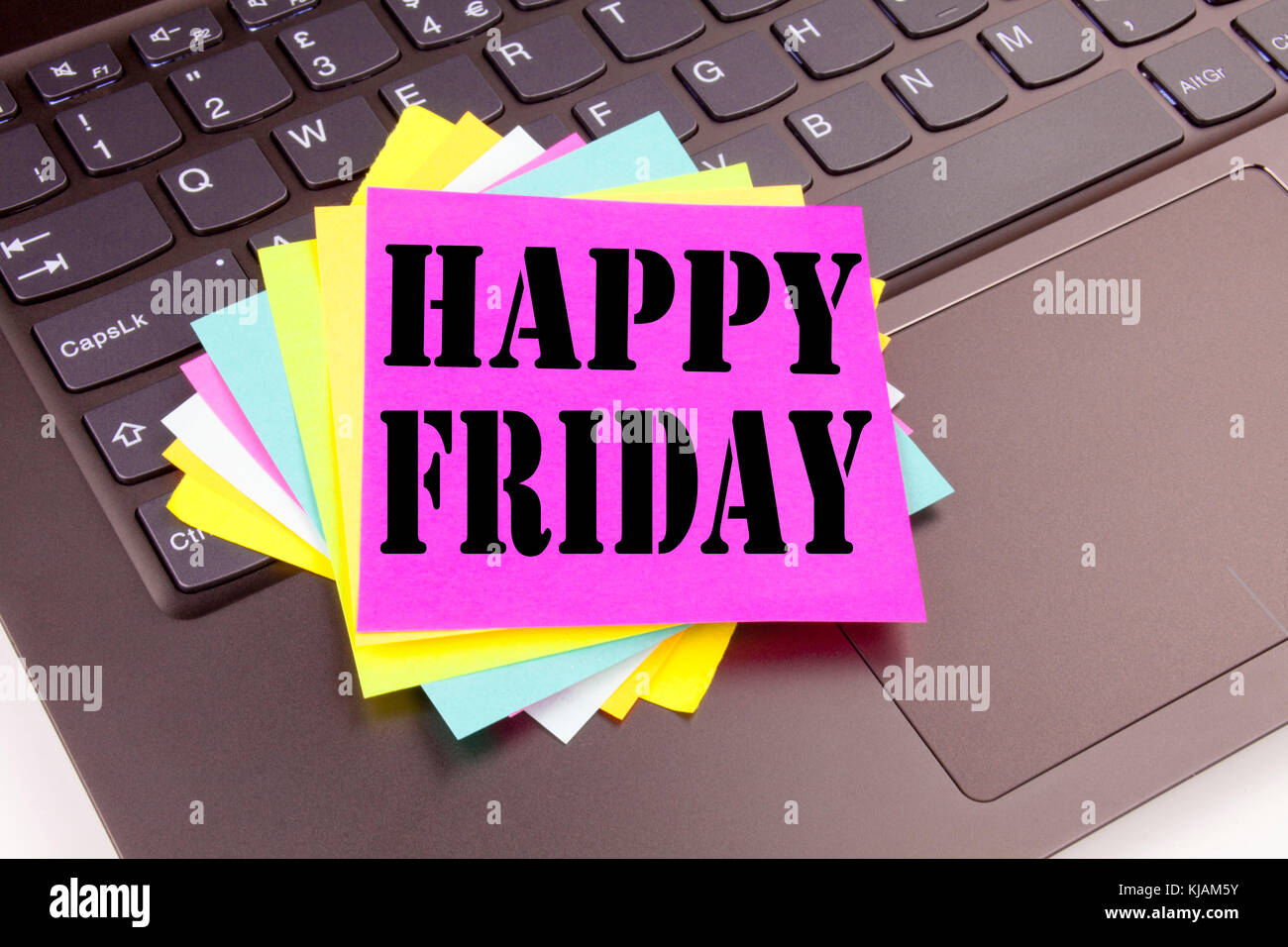 Writing Happy Friday text made in the office close-up on laptop ...