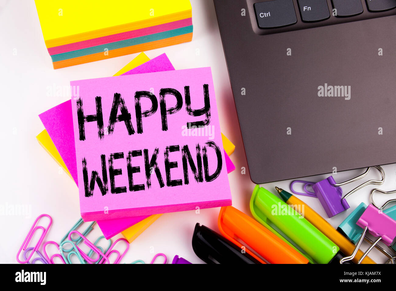 Writing text showing Happy Weekend made in the office with surroundings ...