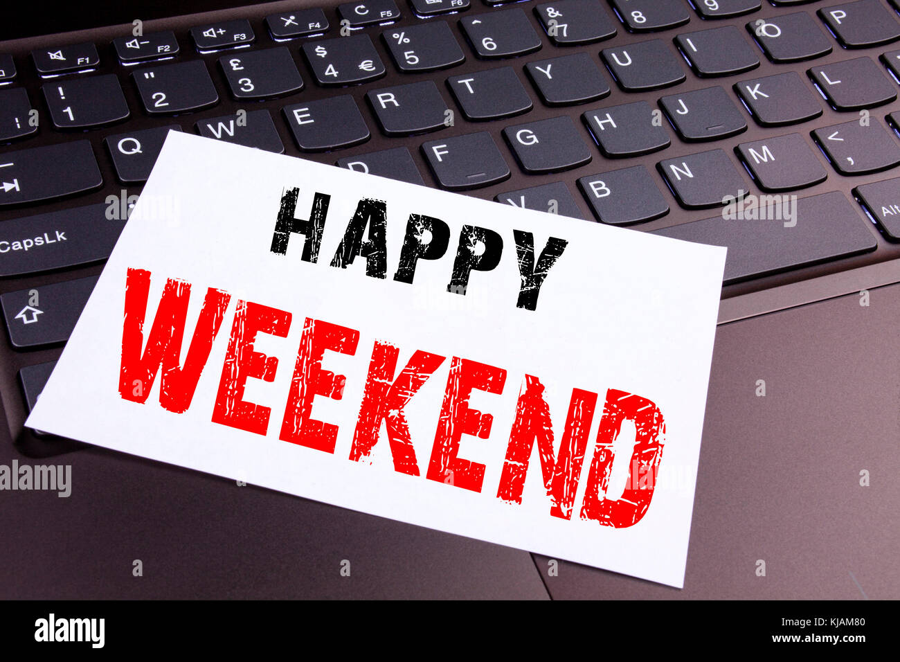 Writing Happy Weekend text made in the office close-up on laptop ...