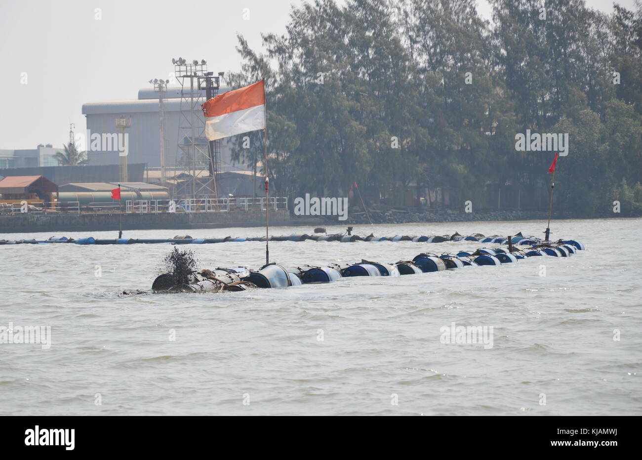 dirt dig pipe tube from embankment to river Stock Photo - Alamy