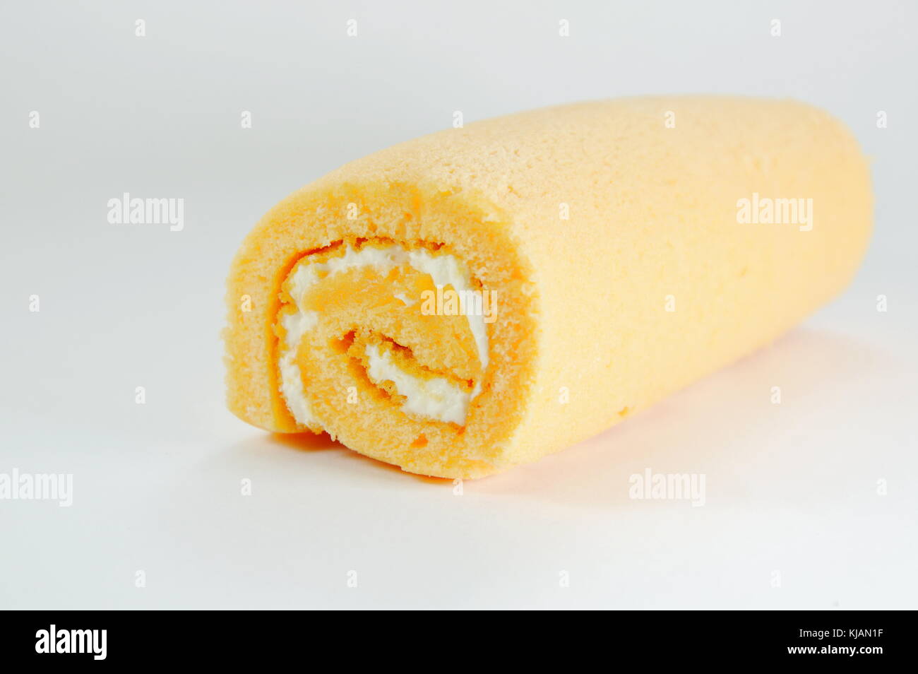 orange jam roll on white background Stock Photo - Alamy