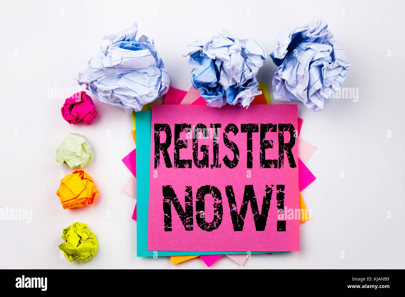 Writing text showing Register Now written on sticky note in office with ...