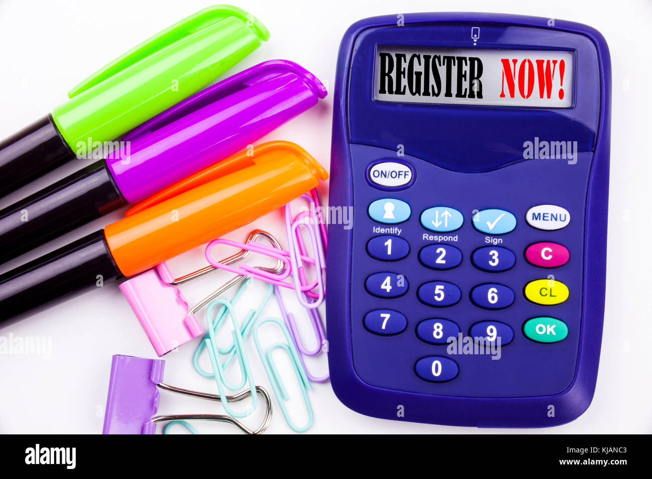 Writing word Register Now text in the office with surroundings such as ...