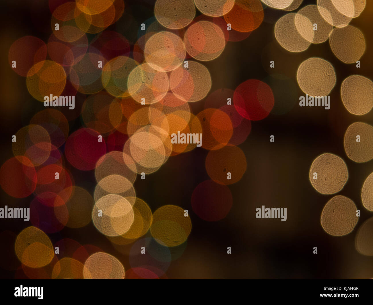 Blurred colorful Christmas lights background over dark background with ...