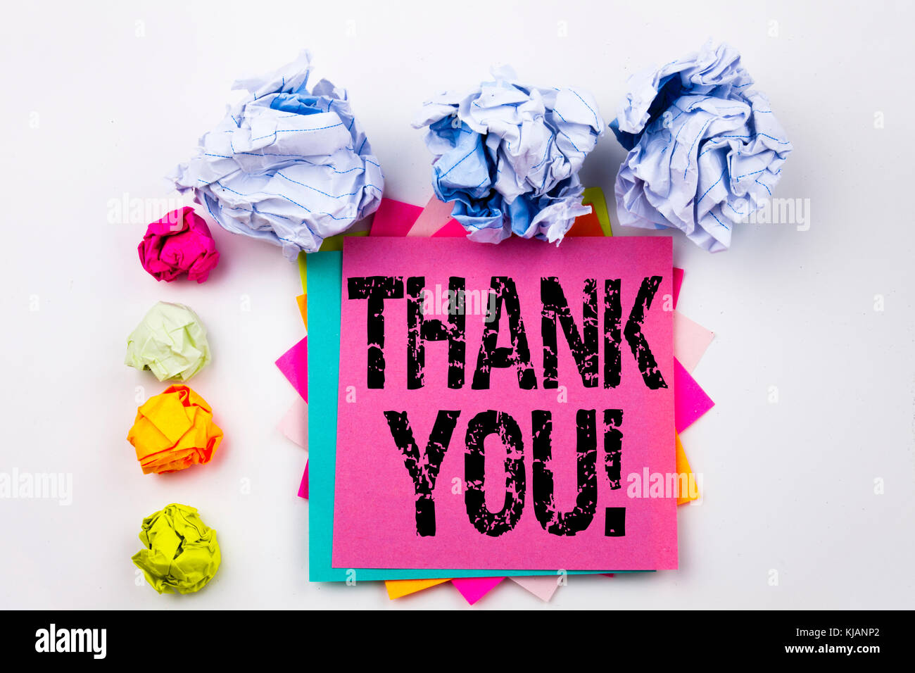 Writing text showing Thank You written on sticky note in office with ...