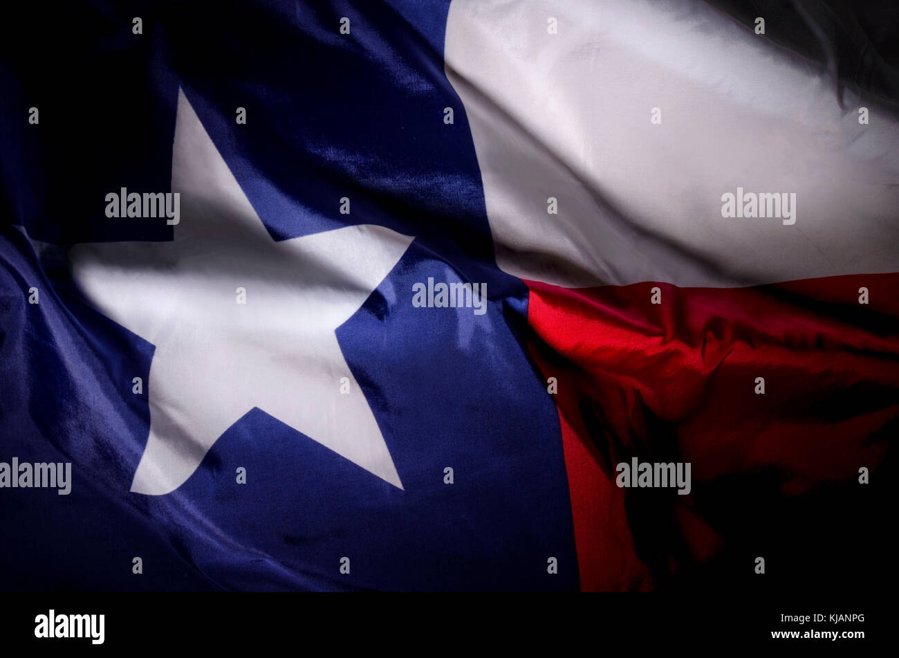The Texas state flag waving in shadow Stock Photo - Alamy
