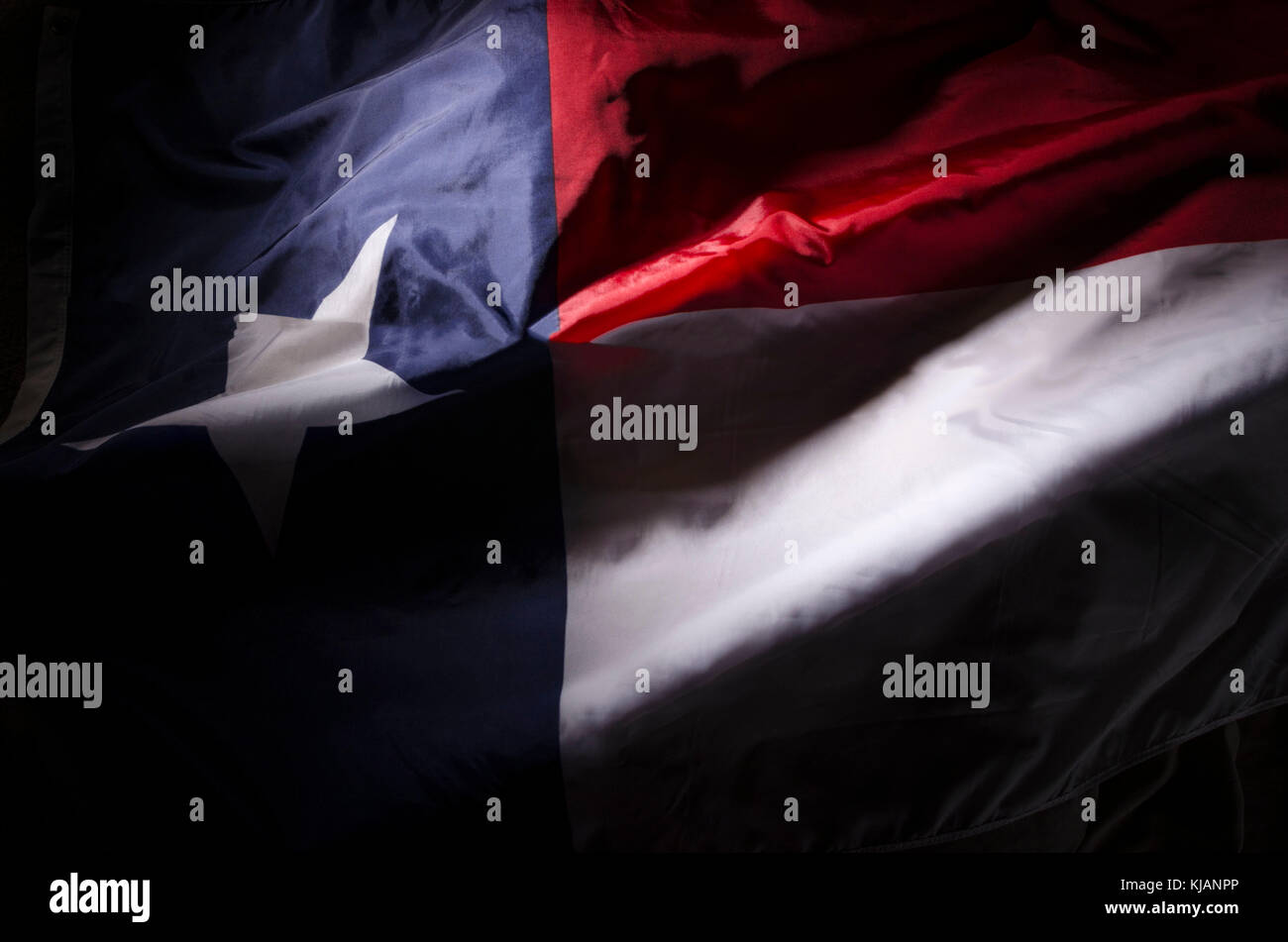 The Texas state flag waving in shadow Stock Photo - Alamy