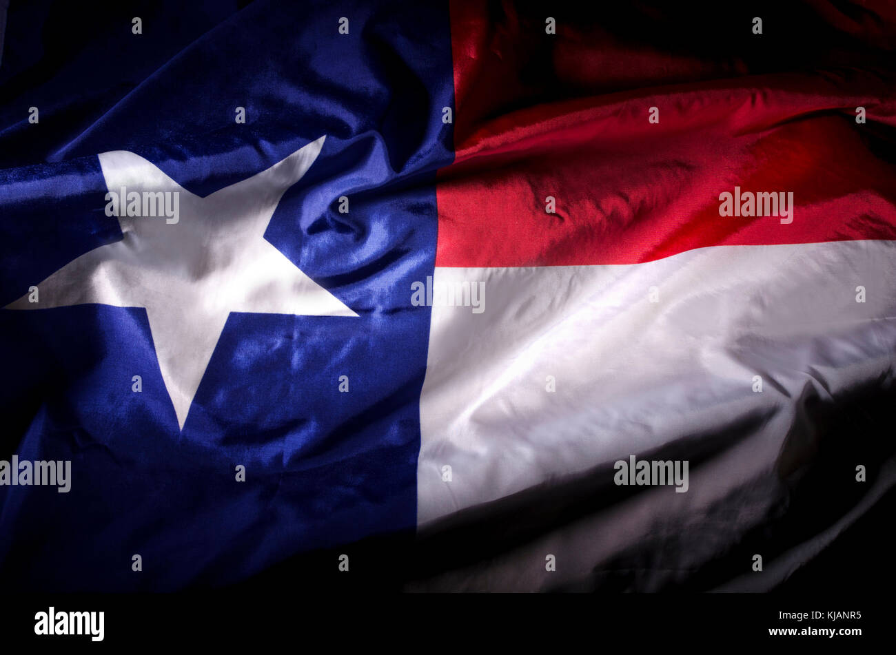 The Texas state flag waving in shadow Stock Photo - Alamy
