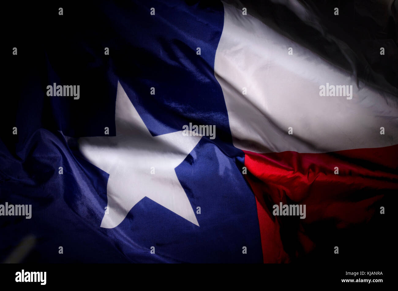 The Texas state flag waving in shadow Stock Photo - Alamy