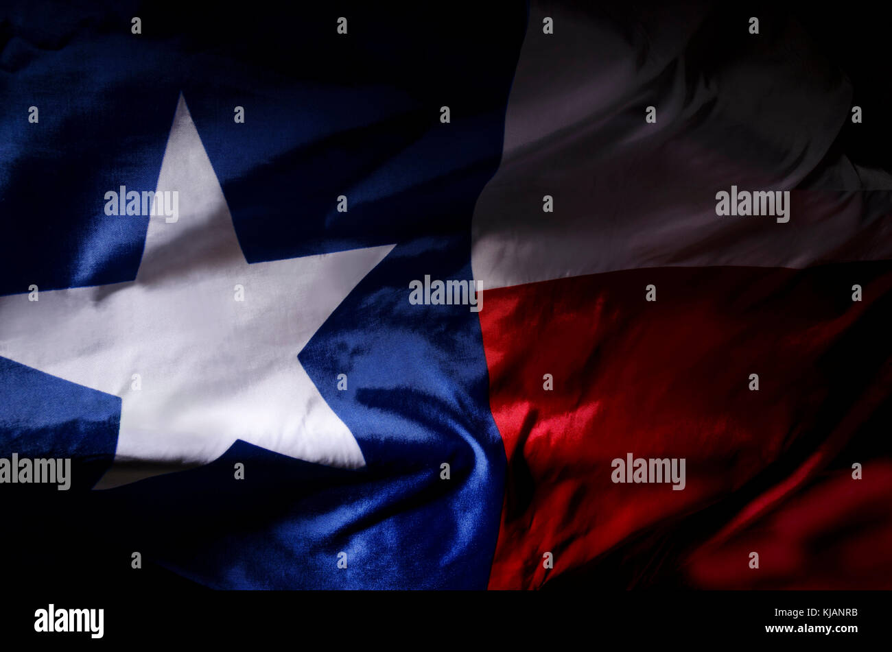 The Texas state flag waving in shadow Stock Photo - Alamy