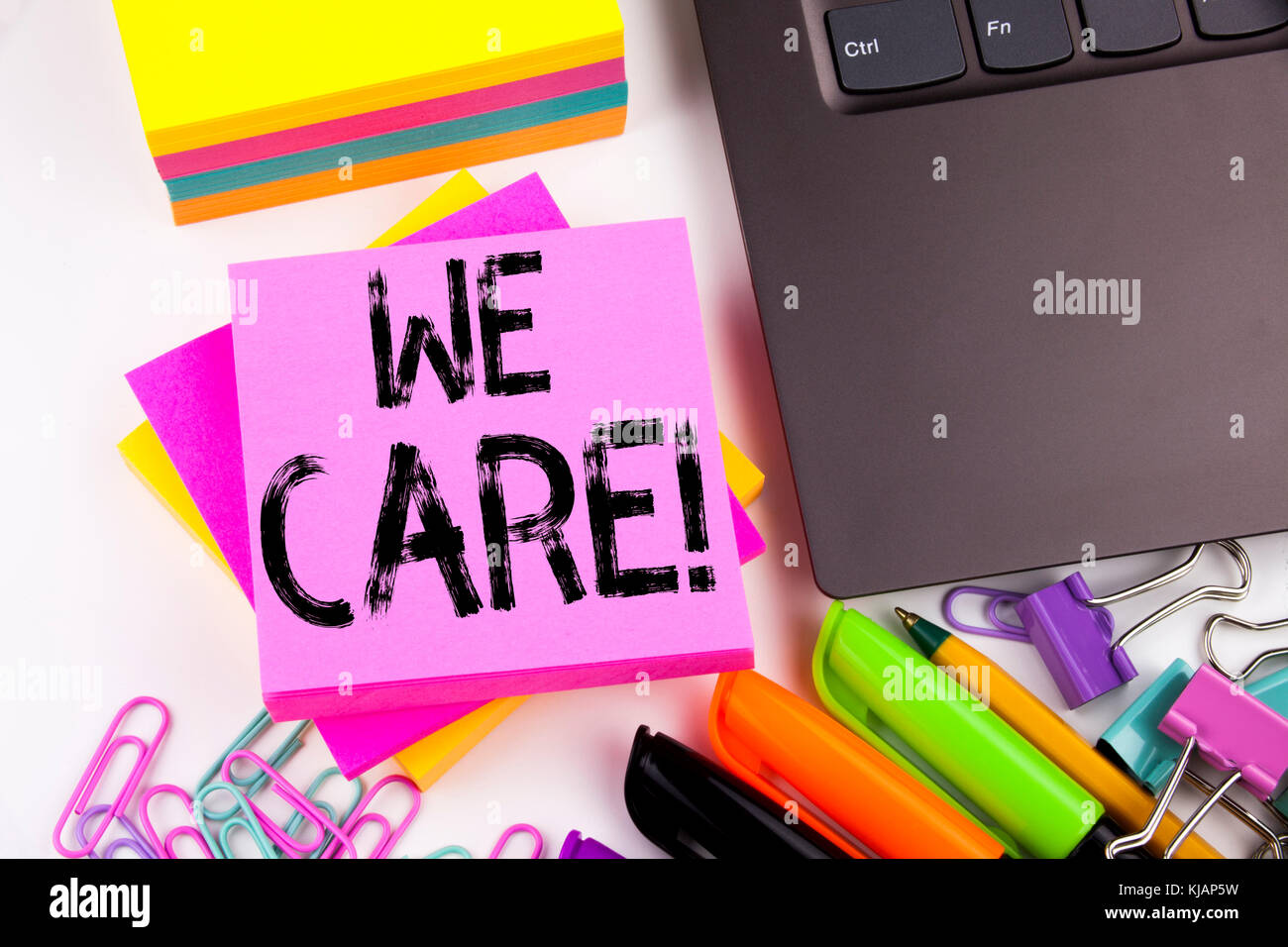 Writing text showing We Care made in the office with surroundings such ...